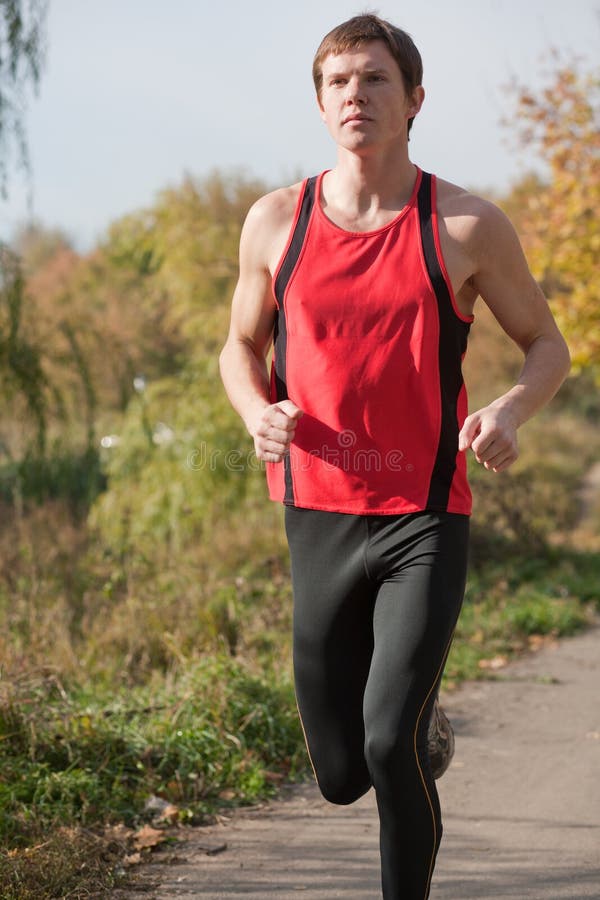 Young man jogging outdoor stock photo. Image of runner - 16855508