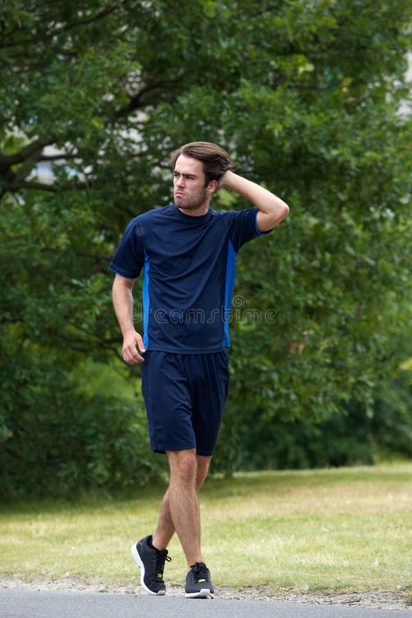 Young man jogging outdoors stock image. Image of endurance - 43041341