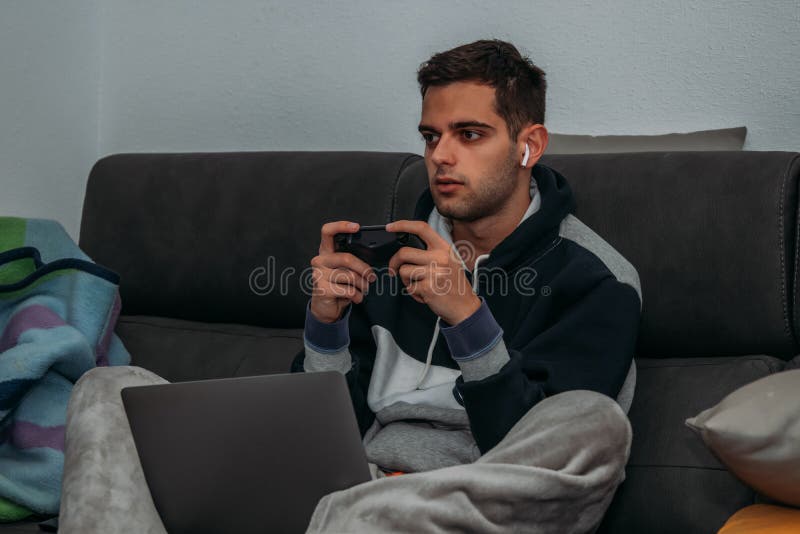 Young Man with Joystick on the Sofa Stock Image - Image of happy ...