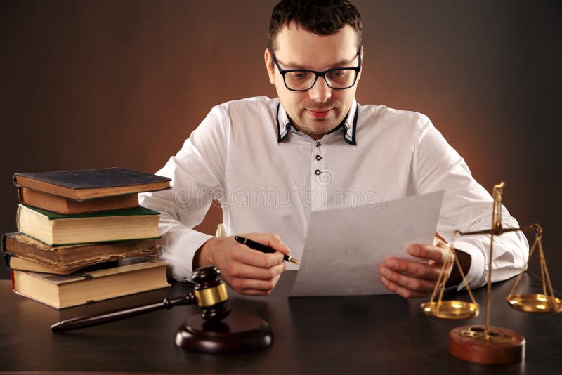 Young Man Judge on His Table Working with Paper Documents. Stock Photo ...