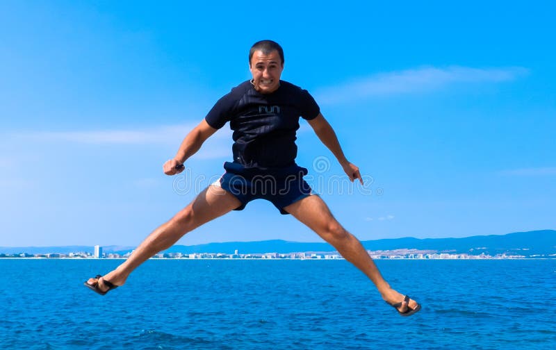 Young Man Jump Over the Sea Stock Photo - Image of hill, leisure: 89090352