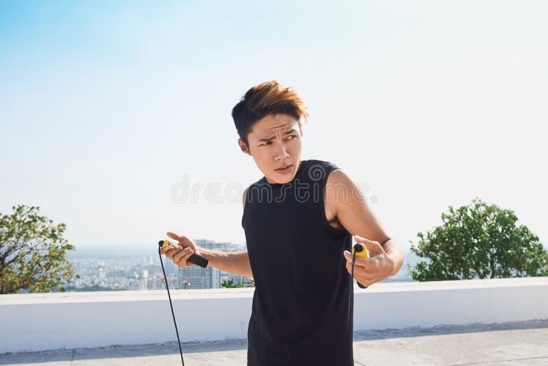 Young Man Jump Roping in the Outdoors Stock Photo - Image of body ...