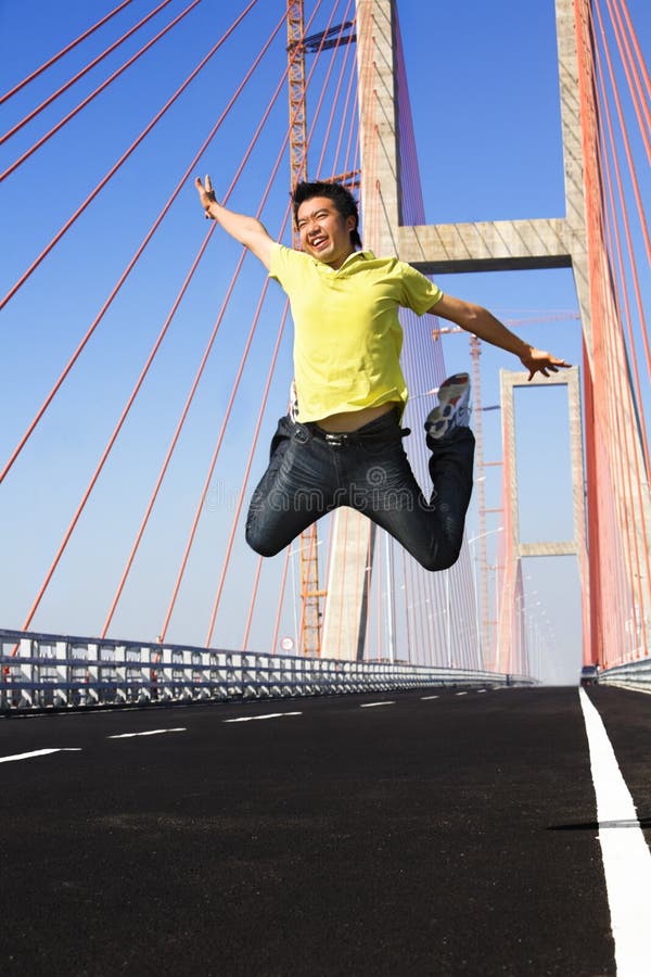 Young Man Jump Very High in Bridge Area Stock Photo - Image of road ...
