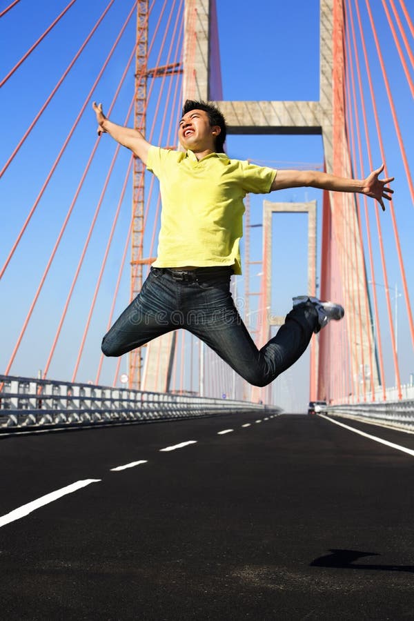 Young Man Jump Very High in Bridge Area Stock Photo - Image of ...