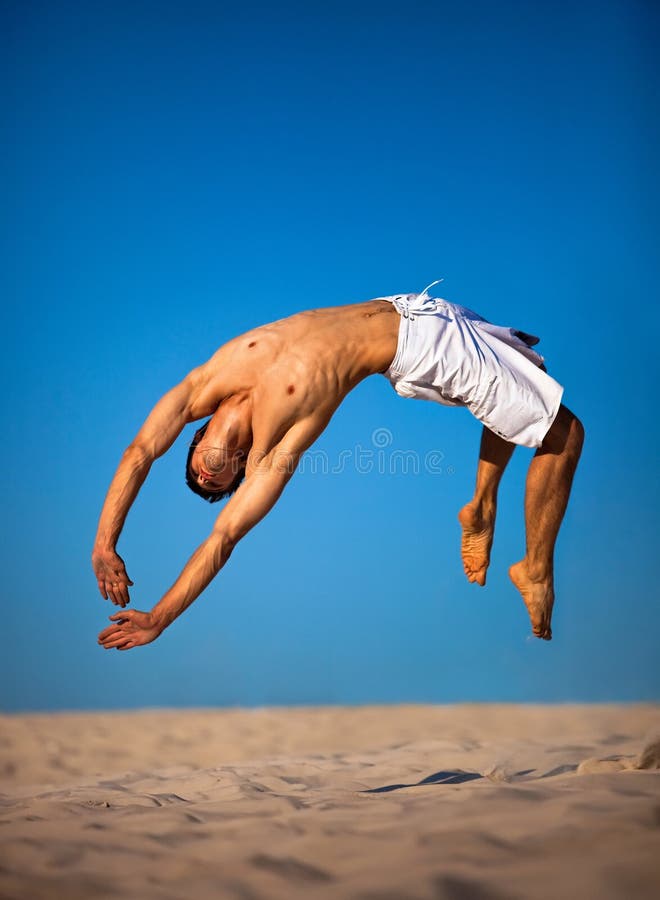 Young man jumping stock image. Image of power, jump, brawny - 15207855