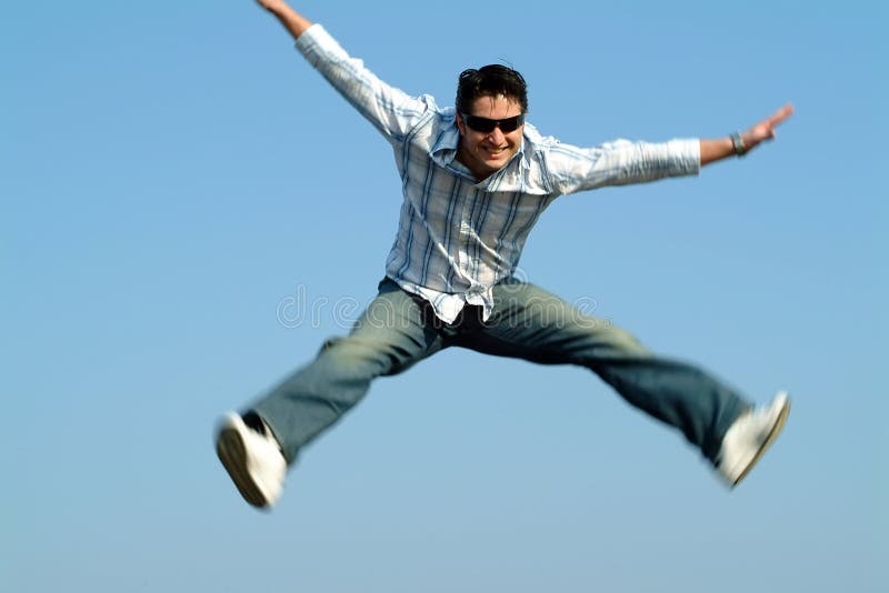 Young man jumping stock image. Image of life, holiday - 2294687