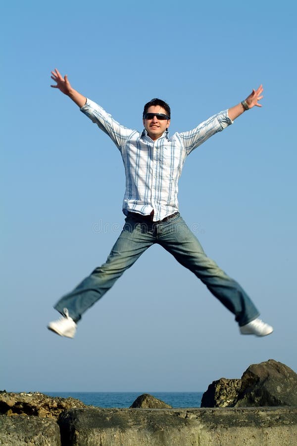 Young man jumping stock image. Image of life, holiday - 2294687