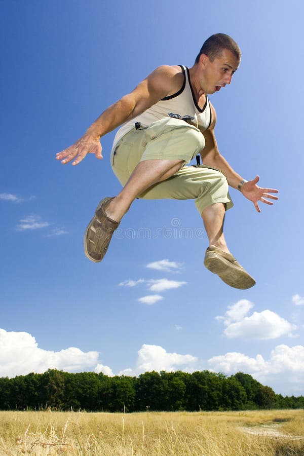 Man Jumping Over Wall stock image. Image of handsome - 20354579