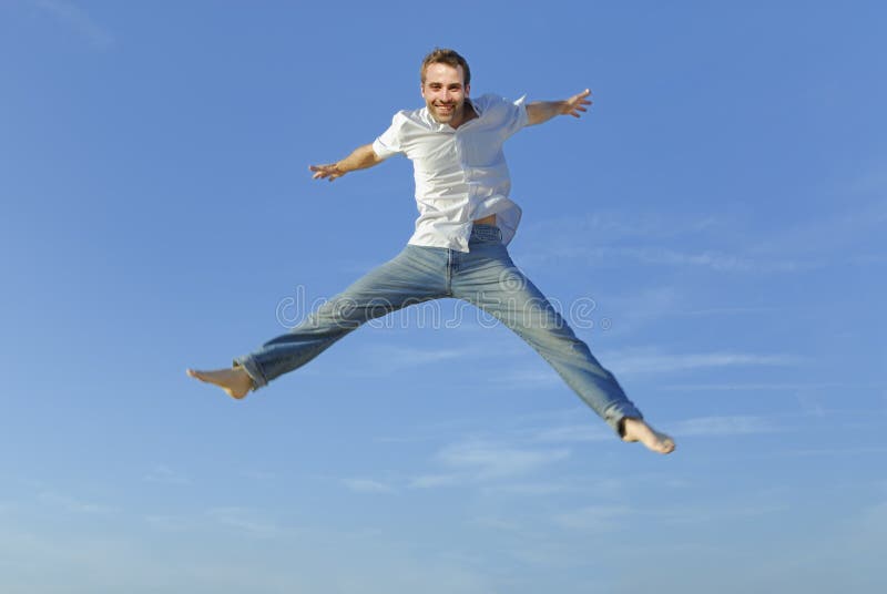 Young Man Jumping in Air Against Light Background Stock Image - Image ...