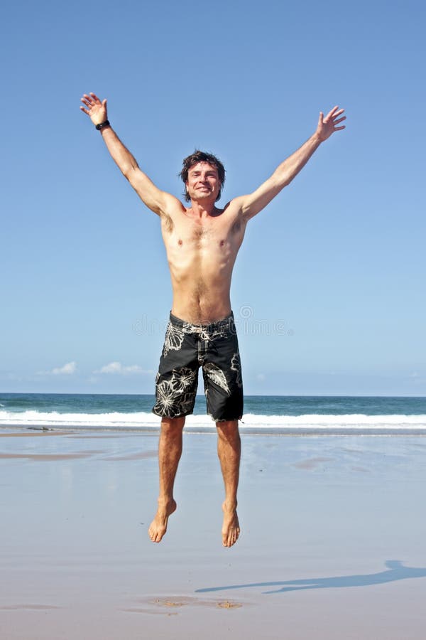 Young Man Jumping in the Air Out of Joy Stock Photo - Image of happy ...