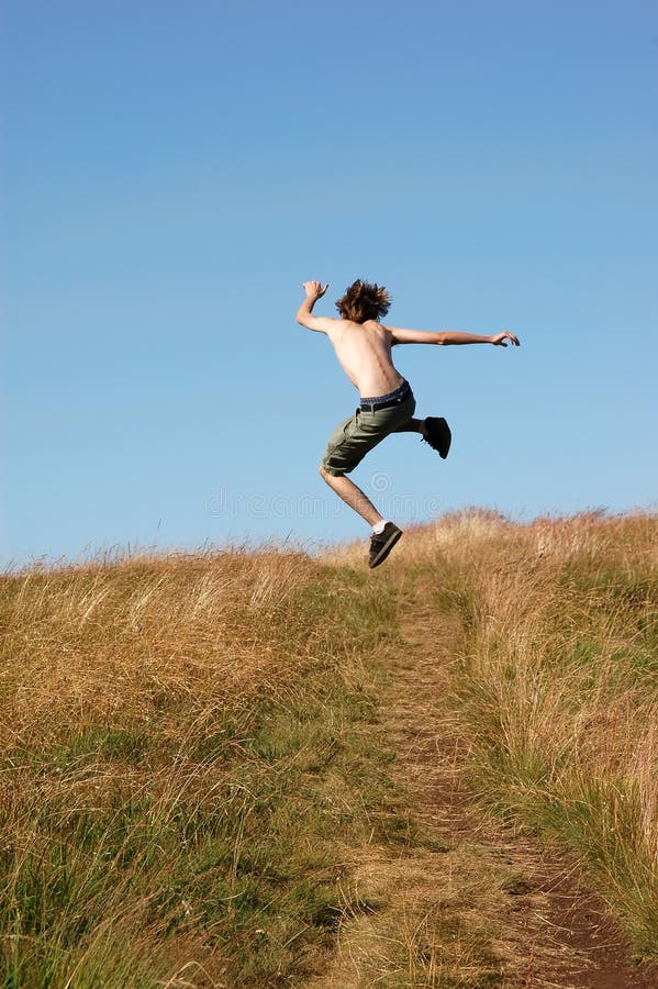 Young man jumping for joy stock photo. Image of freedom - 10455568