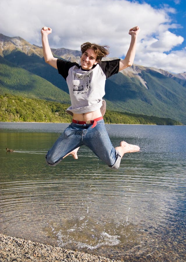 Young man jumping for joy stock image. Image of leaping - 11323613