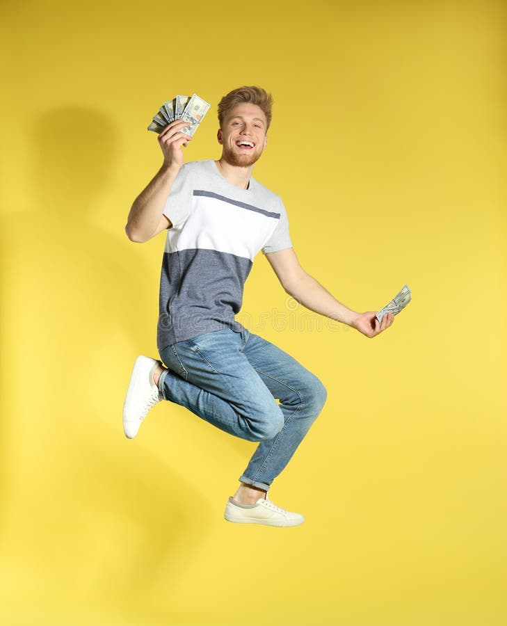 Young Man Jumping with Money Stock Photo - Image of color, money: 146951294