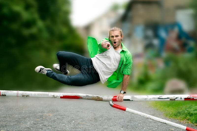 Young Man is Jumping Over a Barrier Stock Photo - Image of dynamic ...