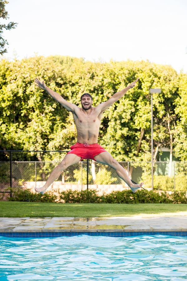 Young Man Jumping in the Pool Stock Photo - Image of excited, tree ...