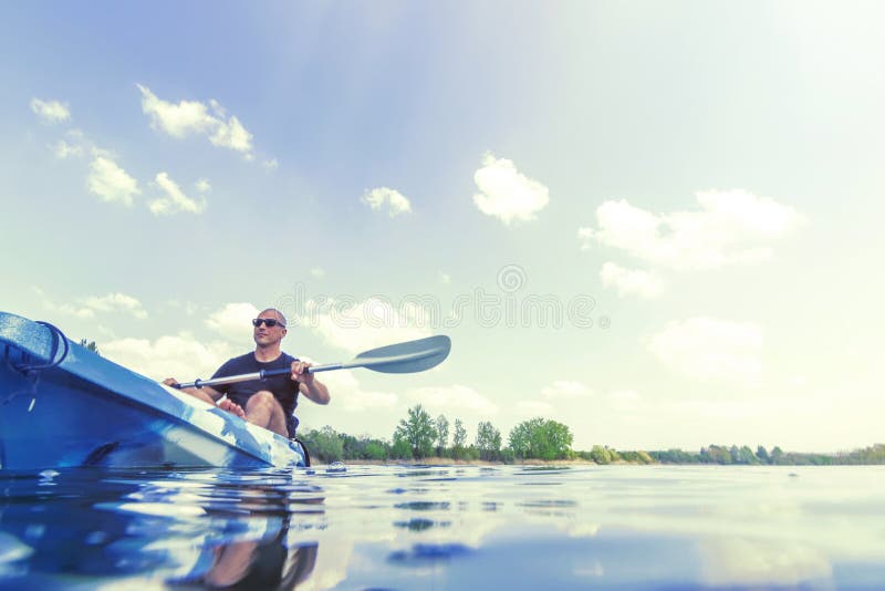 Young Man Kayaking on Lake. Lake Kayaking Stock Photo - Image of ...