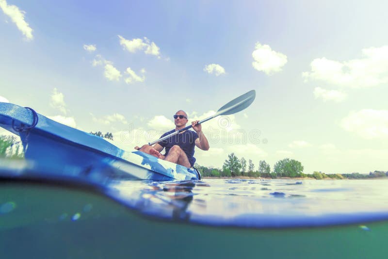 Young Man Kayaking on Lake, Kayaking Underwater View, Split Shot Stock ...