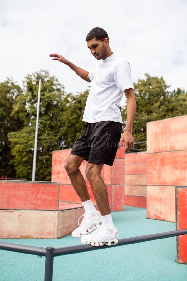 Young Man Keeping Balance and Looking Concentrated Stock Photo - Image ...