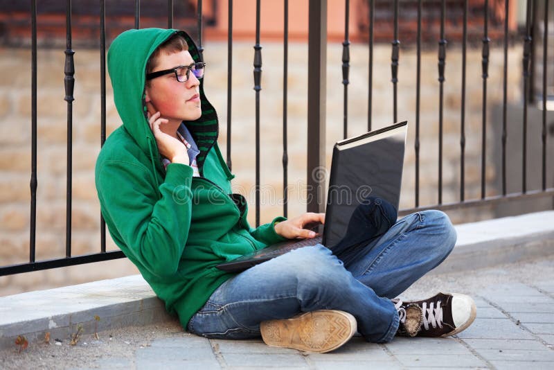Young man with laptop stock image. Image of portrait - 26035259