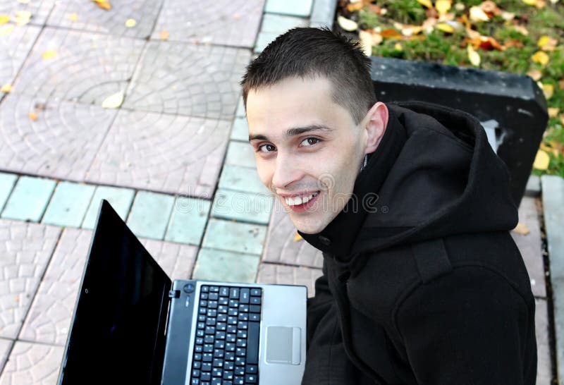 Young Man with Laptop stock image. Image of caucasian - 58719659