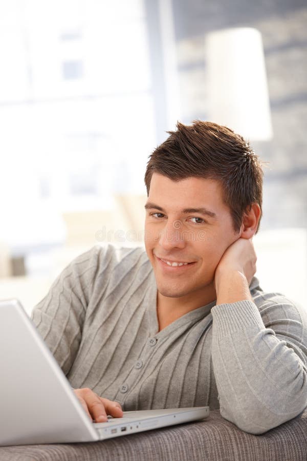 Young guy with computer stock image. Image of look, blond - 19674297