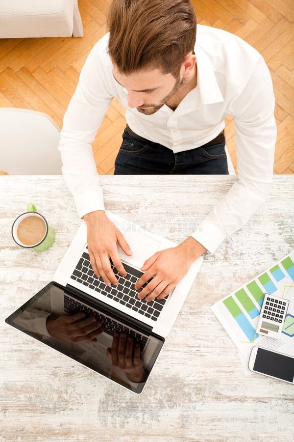 Young Man with a Laptop Computer Stock Image - Image of attractive ...