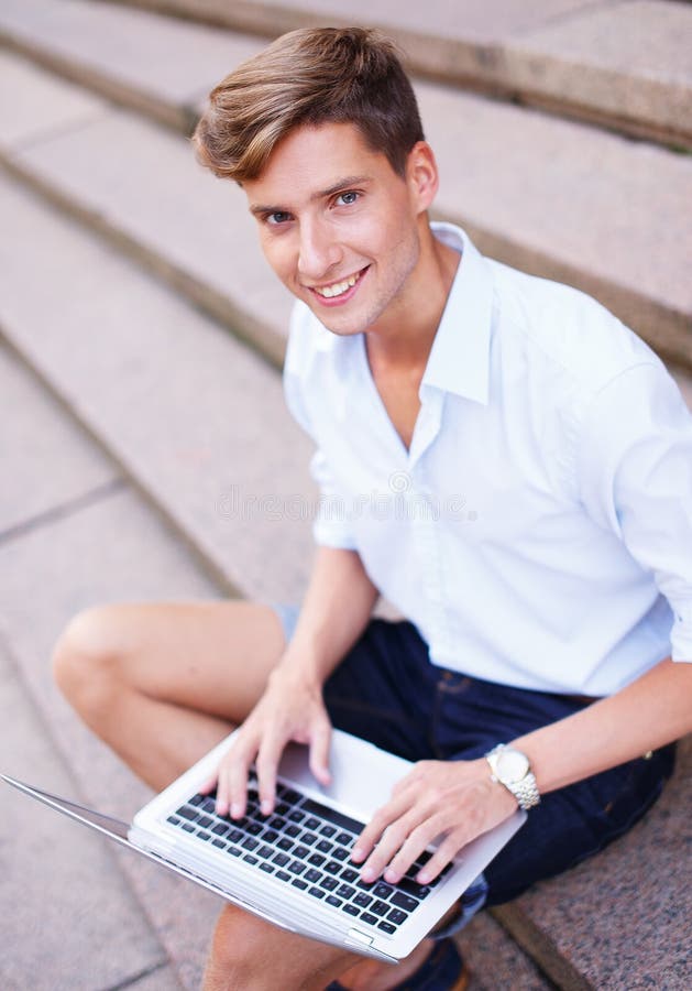 Young man with laptop stock image. Image of business - 34644893