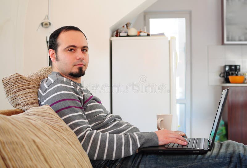 Young Man with Laptop at Home Stock Photo - Image of sitting, handsome ...