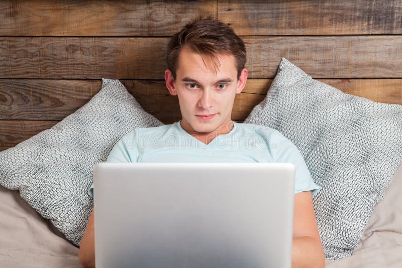 Young Man with a Laptop at Home. Stock Photo - Image of browsing ...
