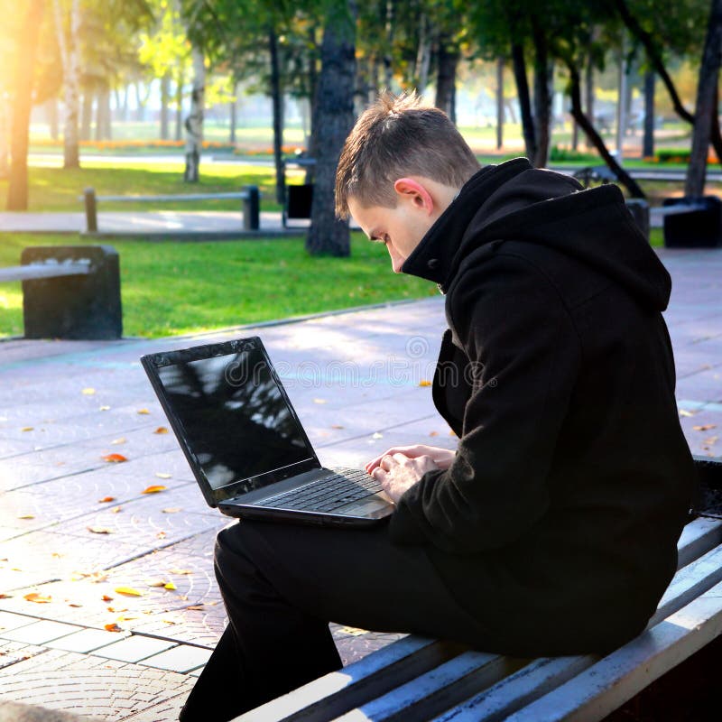 Young Man with Laptop stock image. Image of caucasian - 47990877