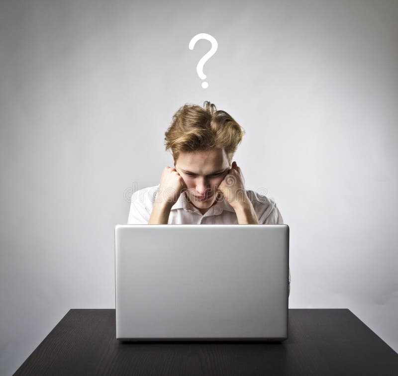 Young Man with Laptop. Question and Ignorance Concept Stock Photo ...