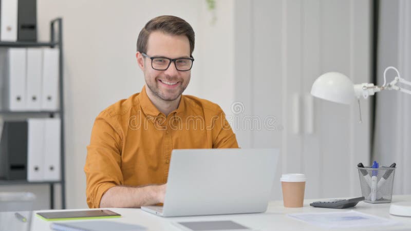 Young Man with Laptop Smiling at the Camera Stock Photo - Image of ...