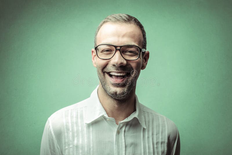 Young man laughing stock image. Image of amazed, glasses - 39495111