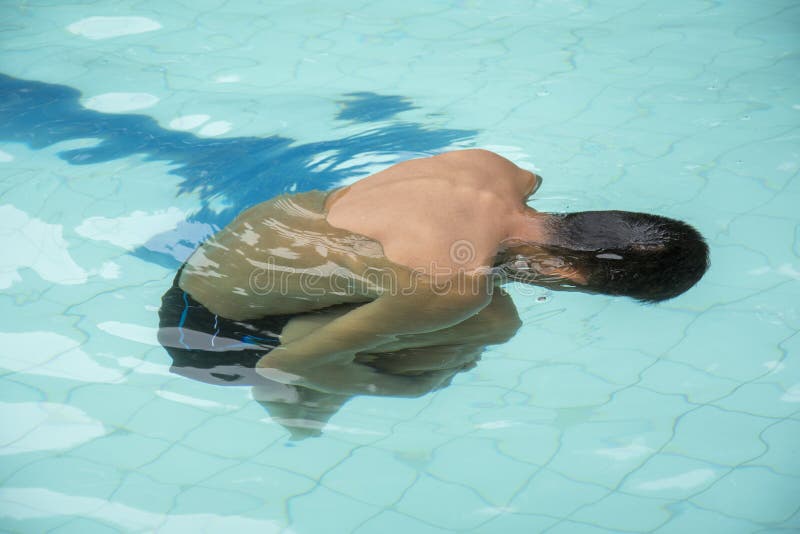 Man Learning Floating in the Pool Editorial Photo - Image of swim ...
