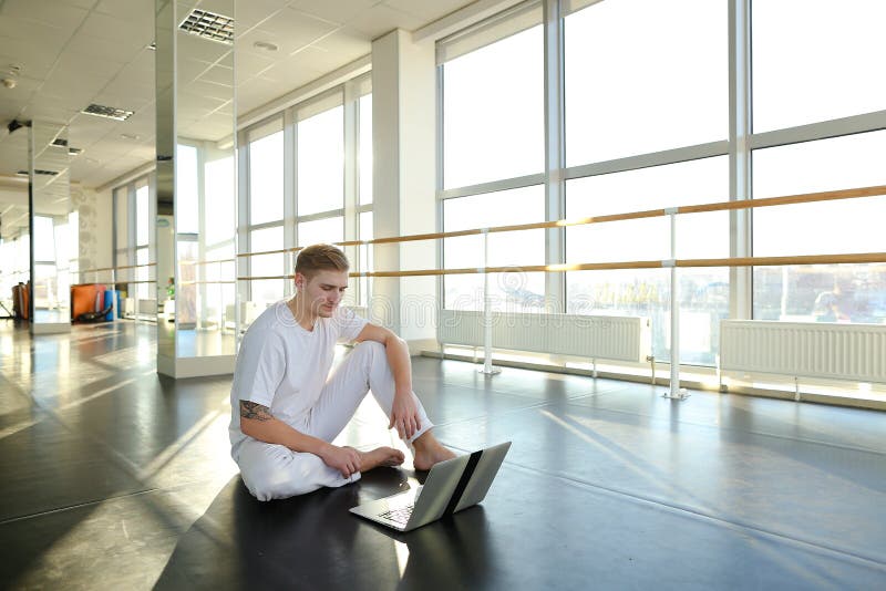 Young Man Learning New Dancing Technique with Laptop Tutorial. Stock ...