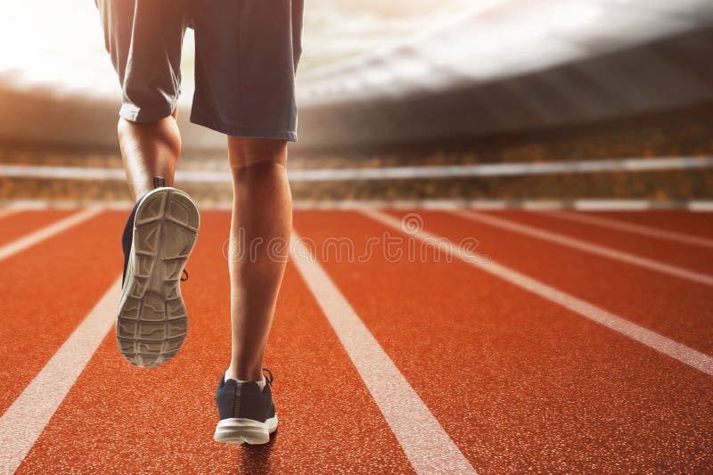 Young Man Legs Running on Stadium Field with Red Asphalt Stock Photo ...