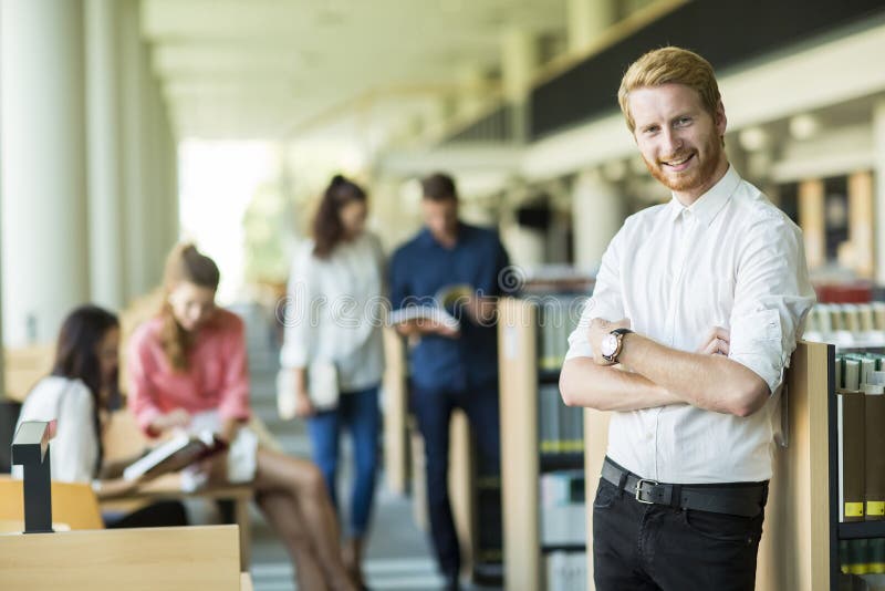 Young people in library stock image. Image of choice - 73284683