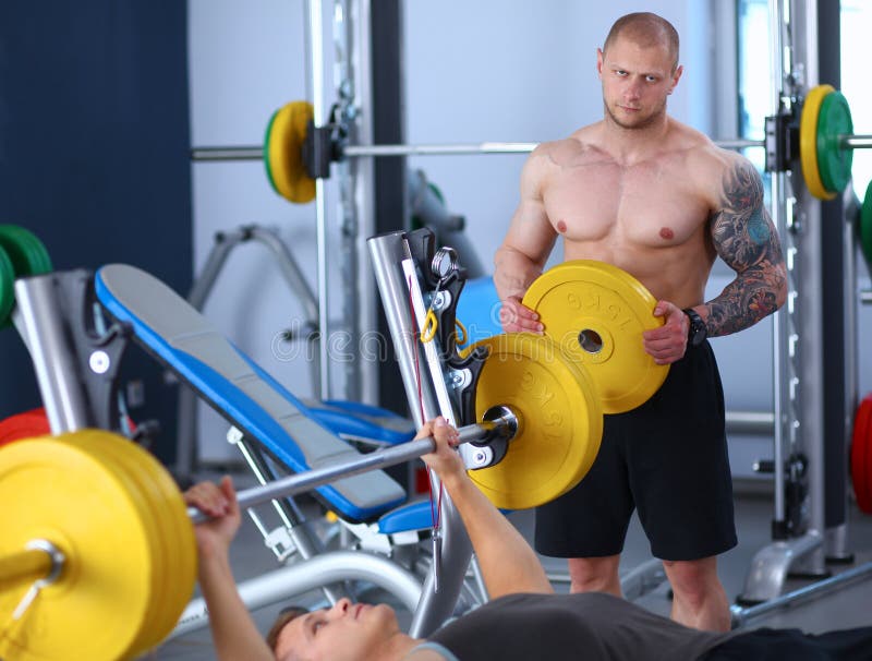 Young Man Lifting the Barbell in Gym with Stock Photo - Image of ...