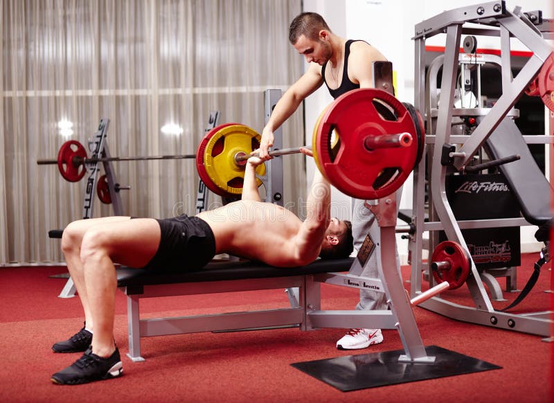 Young Man Lifting the Barbell with Help Stock Image - Image of ...