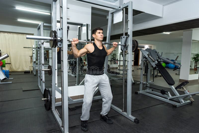 Young Man Lifting Up Barbell in Gym Stock Image - Image of alone ...
