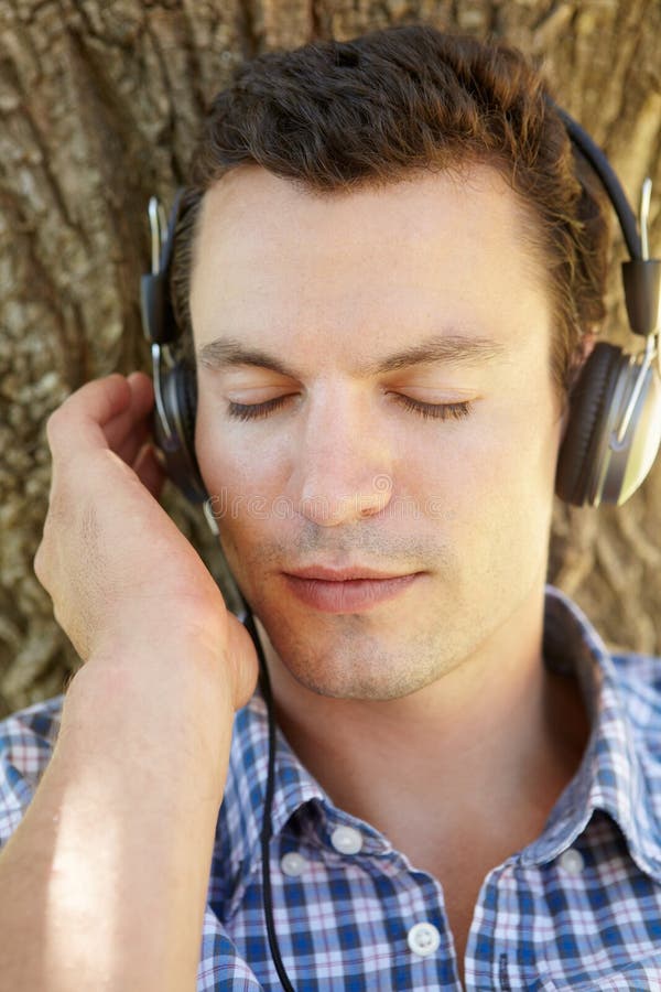 Young man listening music stock image. Image of happy - 19857687