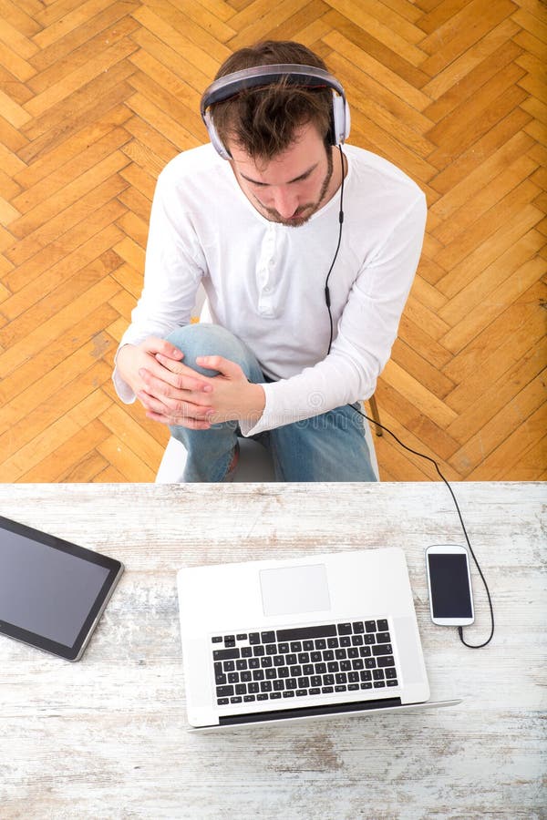 Young Man Listening Music on His Laptop Stock Photo - Image of business ...