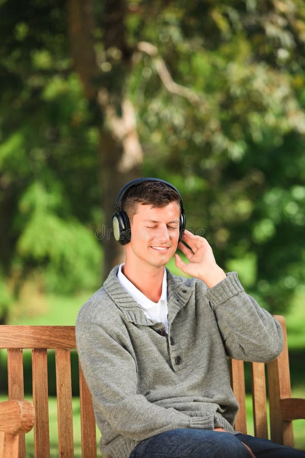 Young Man Listening To Some Music Stock Image - Image of nature ...