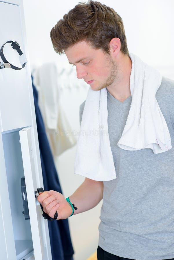 Young man in locker room stock image. Image of player - 90833895