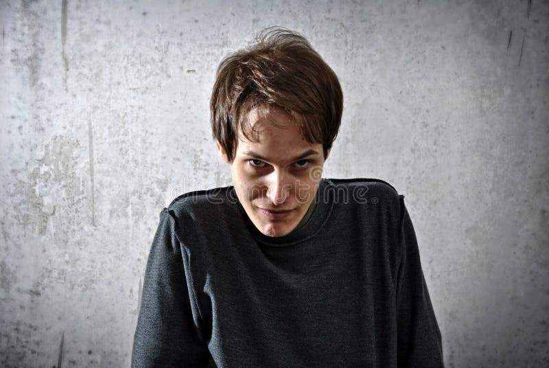 Young Man with a Look of Evil Stock Image - Image of negative, hood ...