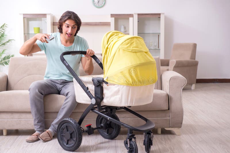 Young Man Looking after Baby in Pram Stock Image - Image of cart ...