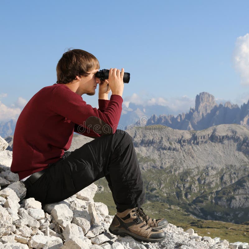 Young Man Looking through Binoculars in the Mountains Stock Image ...