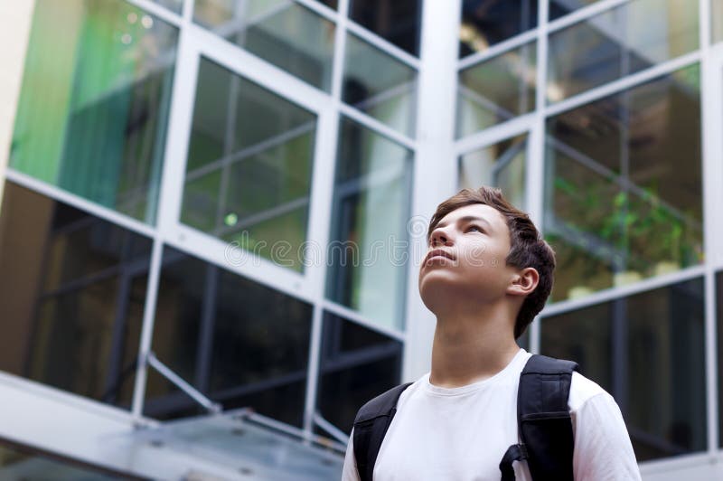Young Man Looking at Business Center Windows Stock Photo - Image of ...