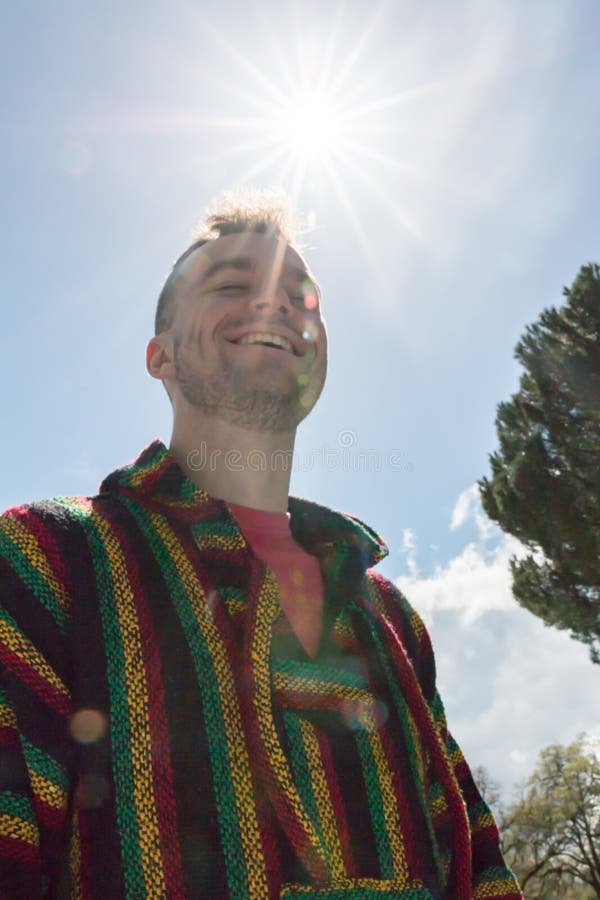 Young Man Looking at Camera with the Sunlight Overhead Stock Photo ...