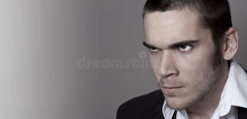 Young man looking defiant. stock image. Image of blue - 17765387